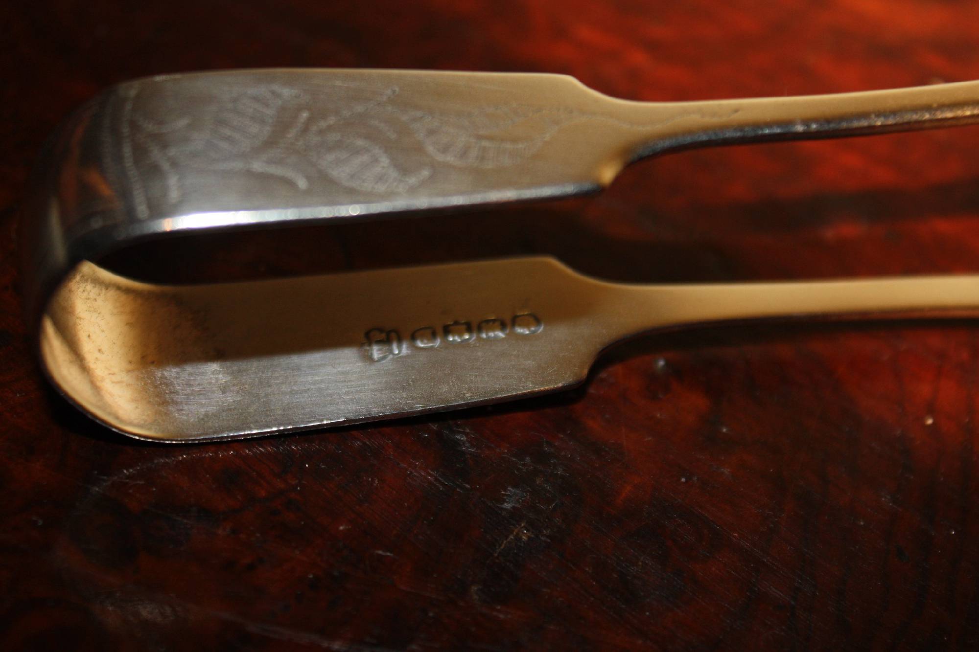 A 19th century silver candy tong, marked